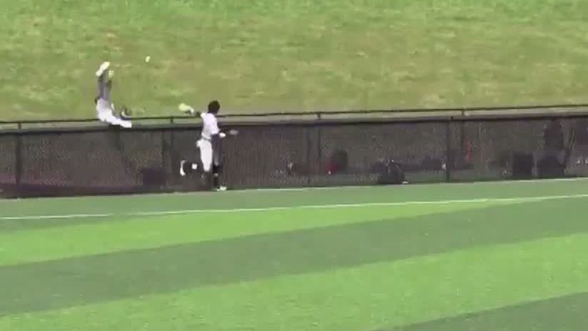 College outfielder dives over fence for absurd catch - ESPN Video