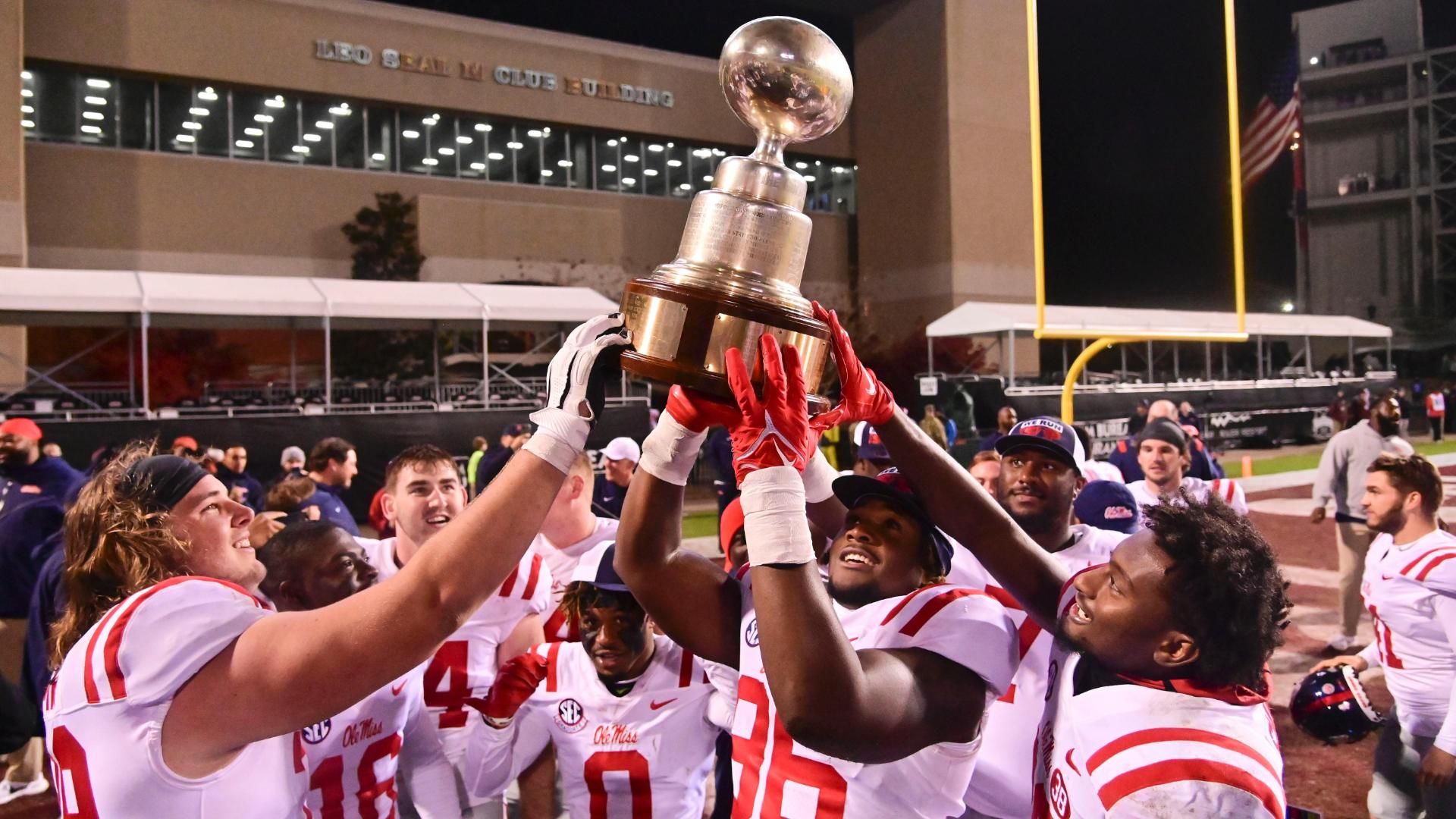 Ole Miss hoists Egg Bowl trophy high after downing Mississippi State ...