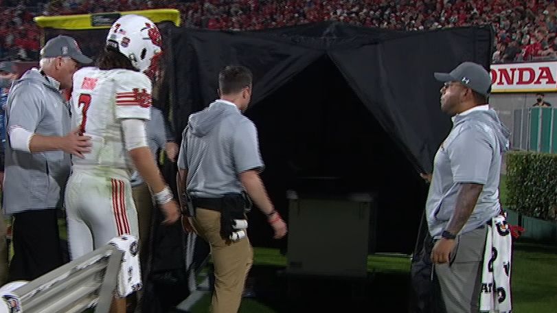 Cameron Rising leaves Rose Bowl after hitting his head on the ground ...