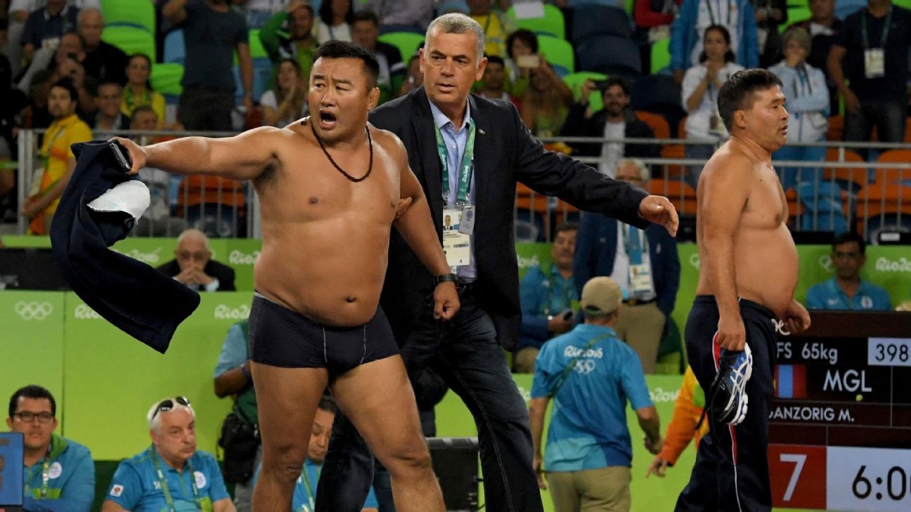 Mongolian wrestling coaches strip off clothing in protest of official's ...